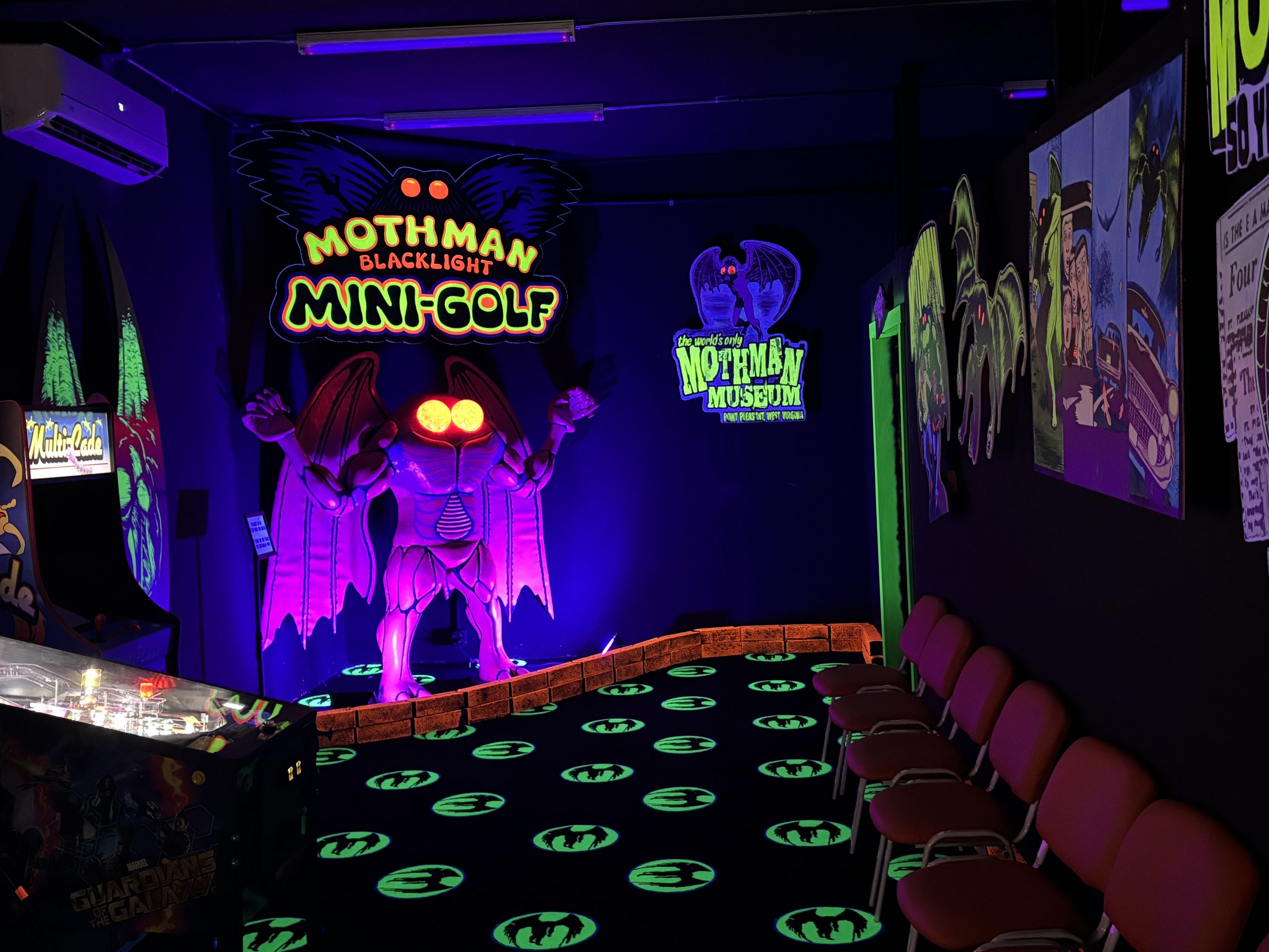Mothman Blacklight Mini Golf: A Glowing Cryptid Adventure